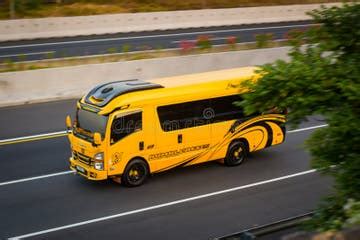 Yellow Isuzu Elf Nlr Microbus On Trans Jawa Toll Road Editorial Image