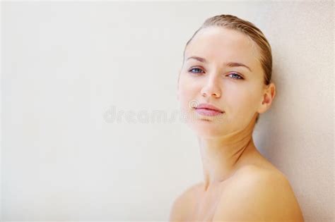 Pretty Topless Female Isolated Against A Brown Wall Portrait Of A Cute