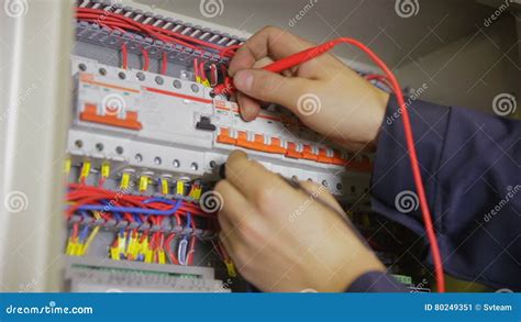Electric Breaker Box Electrician Testing And Switching Fuse Breaker In A Fuse Box Stock Video