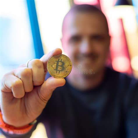 Man Holding Digital Crypto Currency Coin Of Bitcoin Stock Photo Image Of Exchange Crypto