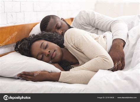 Husband And Wife Sleeping Together