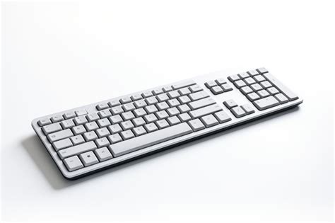 Premium Photo Computer Keyboard On White Surface A Computer Keyboard Is Placed On Top Of A