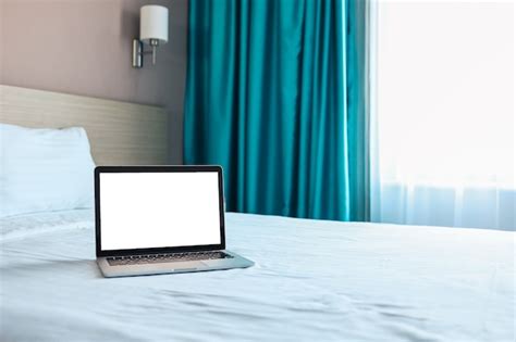 Premium Photo Mock Up Blank Screen Laptop On The Bed For Advertising And Text