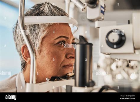 Optometry Slit Lamp And Eye Exam By Senior Woman Or Patient With