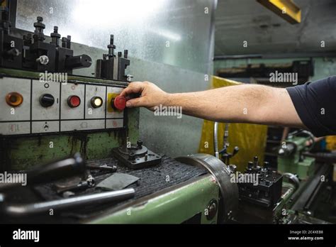 Mid Section Of A Male Factory Worker Pressing Machine Button At The Factory Stock Photo Alamy