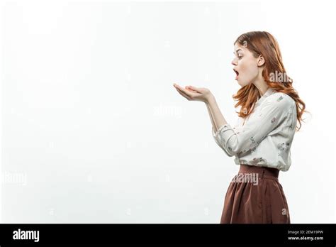 Cheerful Red Haired Woman Holding Hands In Front Of Her Lifestyle Copy