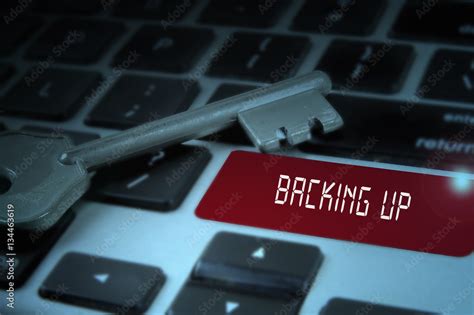 Key And Keyboard With Cyber Security Conceptual Text Low Light Stock Photo Adobe Stock