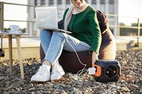 Premium Photo Lady Connecting Laptop To Power Supply Via Cord Outdoors