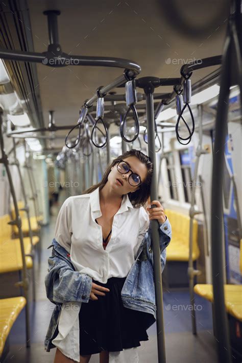 Sexy Model Is Posing In Carriage Of Metro Train Stock Photo By BLACKDAY