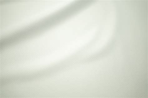 화이트 풋볼 저지 의류 직물 질감 스포츠 웨어 배경 클로즈업 스포츠 의류 패브릭 텍스처 배경 천 섬유 표면의 상단 보기 화이트