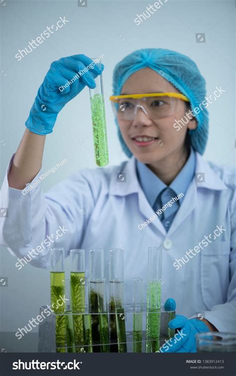 Scientist Testing His Experiment In A Science Laboratory Chemical