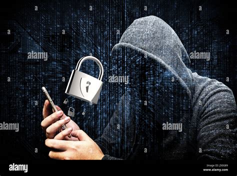 Double Exposure Of Hooded Cyber Crime Hacker Using Mobile Phone