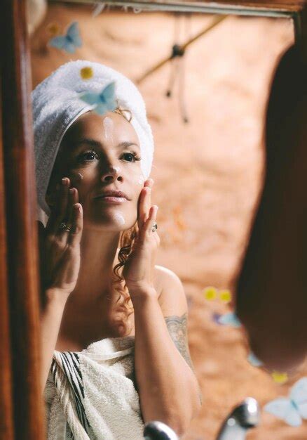 Premium Photo One Attractive Adult Woman Taking Care Of Her Skin Face