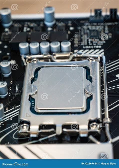 Closeup View Of A CPU Socket With Processor Installed On A Black Motherboard Stock Photo Image