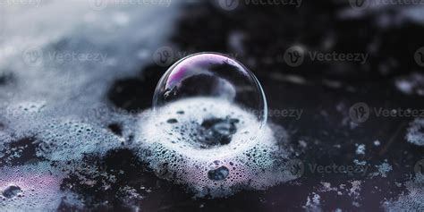 A Vibrant Soap Bubble Floats Gracefully In A Sea Of Soapy Water