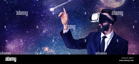 Businessman Wearing Virtual Reality Glasses Against Color Background With Stars And Comet Stock