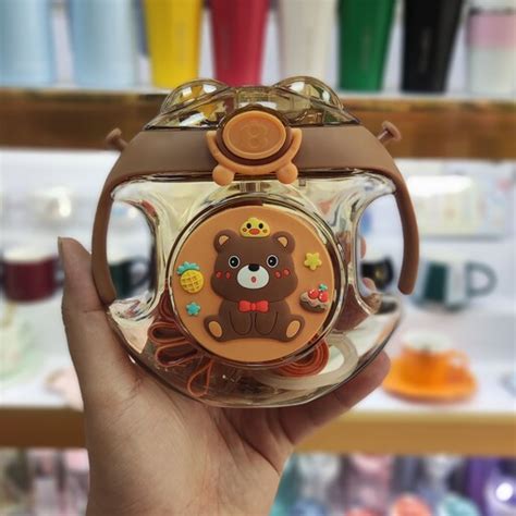 خرید و قیمت قمقمه دوناتی اسپری دار چراغ دار دسته دار دارای بند بلند از