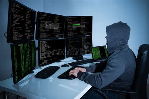 Hacker Using Multiple Computers To Steal Data Stock Photo Image Of