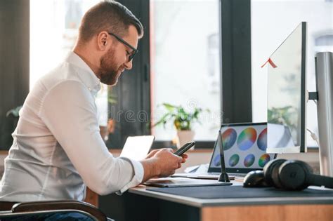Man In Formal Clothes Is Working In The Modern Office Using Computer
