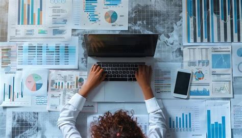 Premium Photo An Overhead View Of A Data Analyst Using A Laptop