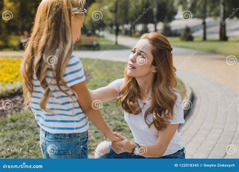 Beautiful Mother Feeling Worried While Taking Her Daughter To School
