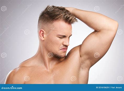 Man Smelling And Armpit In Studio For Health Cleaning And Wellness Or Body Oudor Male Person