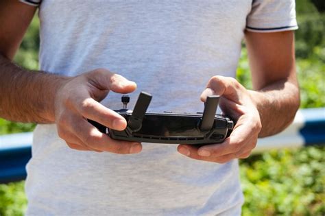Premium Photo A Man Holds A Drone Control Panel