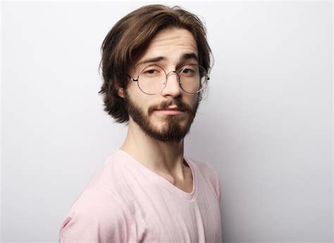 Premium Photo Cheerful Man Wearing Glasses Glad To Find Suitable Well