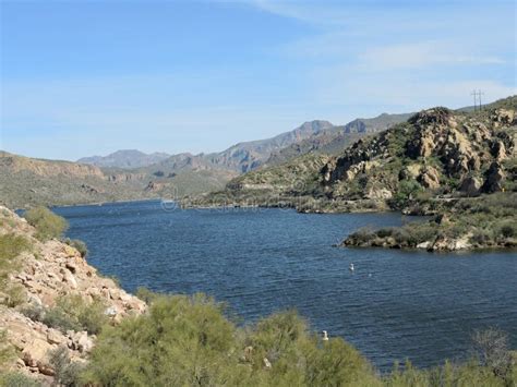 A View Of Beautiful Apache Lake In Arizona With A Small Bridge In The