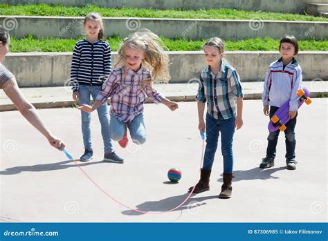 Positive Girl Jumping While Jump Rope Game Stock Image Image Of Ordinary Chinese 87306985