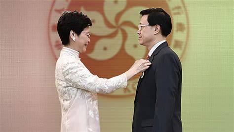 林鄭臨走埋陷阱特首李家超任內獲頒大紫荊 林鄭月娥 李家超 授勳 大紫荊勳章 光大控股 陳爽 希望之聲