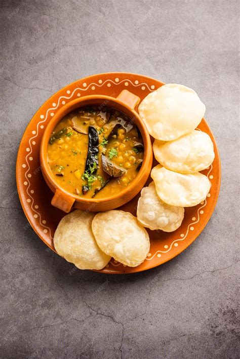 Free Photo Luchi Cholar Dal Or Fried Bread Made Of Flour Served Along
