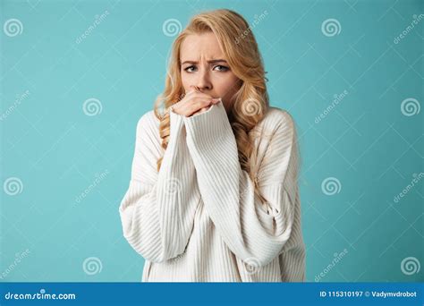 Portrait Of A Scared Young Blonde Girl Looking At Camera Stock Image