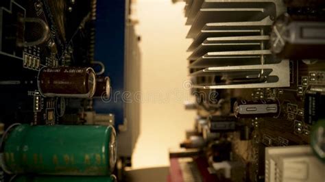 View From The Inside Of Computer System Unit With Motherboard Chip Capacitors Slots For RAM
