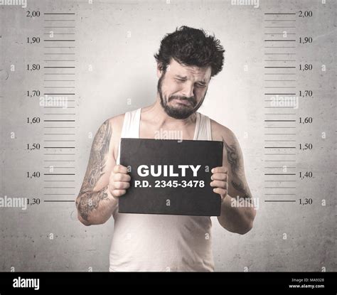 Caught Guilty Man With ID Signs On His Hand Stock Photo Alamy