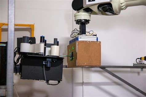 dexterity introduces robotic print and apply palletizer robotics