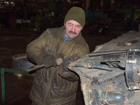 A Former Russian Btr 80 Apc Undergoing Refurbishment Alongside A Captured Mt Lb Armoured