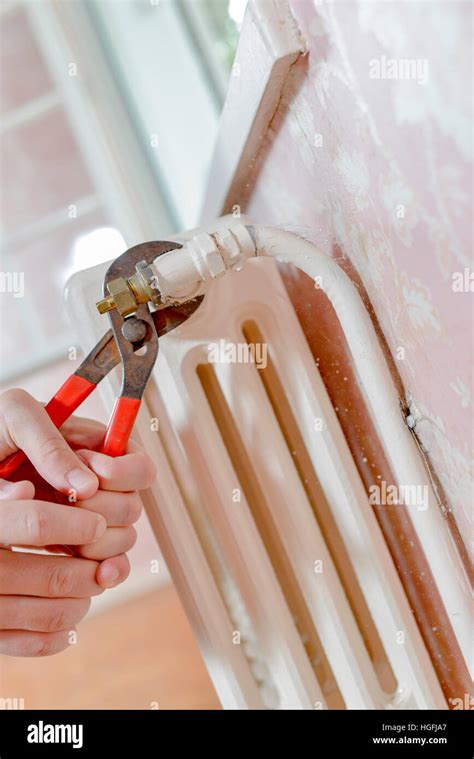 Fixing A Radiator Stock Photo Alamy