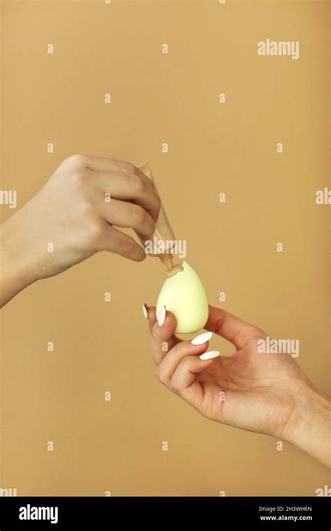 Crop Women Applying Foundation On Sponge Stock Photo Alamy