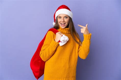 Premium Photo Woman With Christmas Hat And Santa Bag