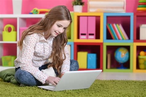 Premium Photo Portrait Of Beautiful Cute Girl Using Laptop