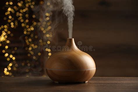 Aroma Oil Diffuser On Wooden Table Against Blurred Lights Stock Illustration Illustration Of