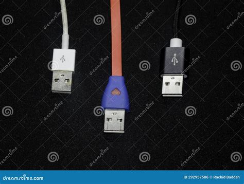 A Usb Cable Connects Your Phone And Laptop On The Black Table Royalty Free Stock Image