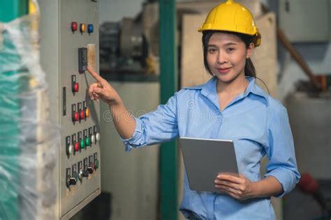 Industrial Factory Worker Standing At Electronic Machine Control Panel In Factory Stock Image