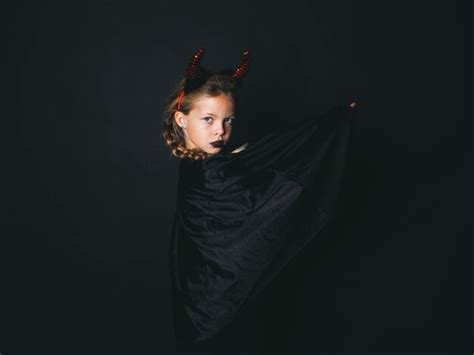 Premium Photo Side View Portrait Of Girl Wearing Devil Costume