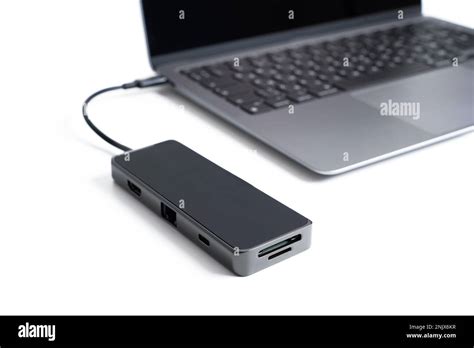 Sleek And Modern Usb Hub With Multiple Ports Connected To A Laptop Complementing Its Aesthetic