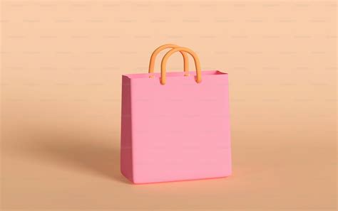 나무 손잡이가 달린 분홍색 쇼핑백 사진 Unsplash의 풀 Hd 월페이퍼 이미지