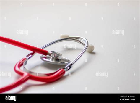 Red Stethoscope In Doctors Office For Professional Cardio Checkup And Healthy Heartbeat Pulse