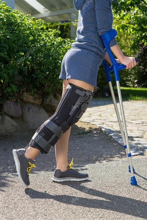 Woman Wearing A Leg Brace Side View Stock Photo By Belahoche