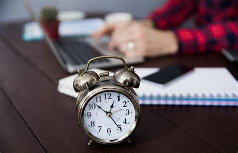 Premium Photo Man Working With Clock On Desk